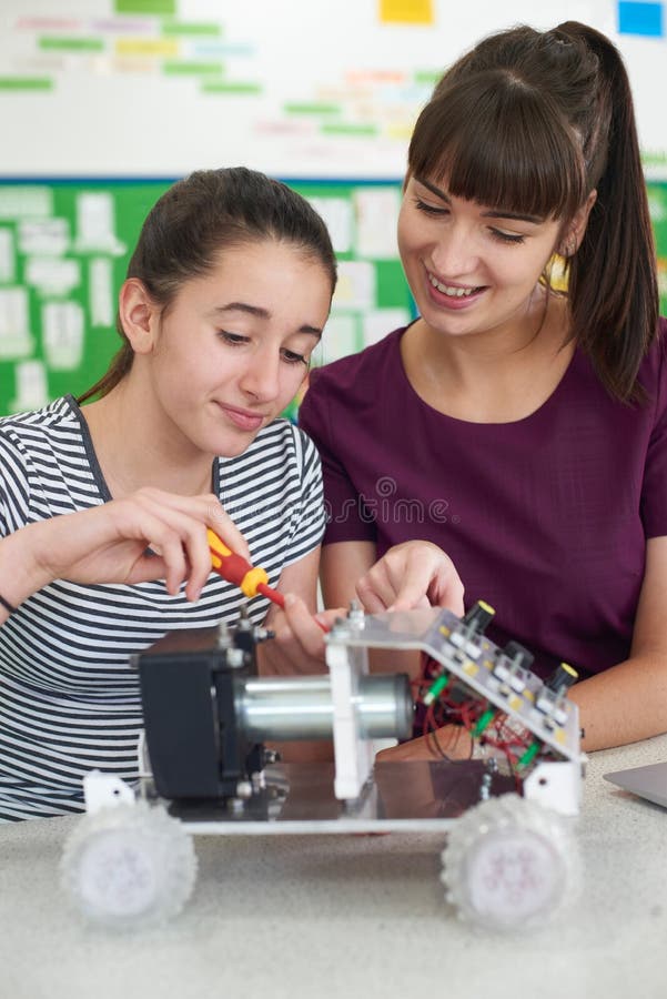 Portrait of Teacher with Female Pupil Studying Robotics in Science ... Portrait of Teacher with Female Pupil Studying Robotics in Science ...