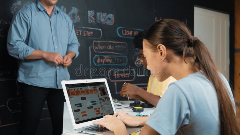 Teacher Teach about Coding System while Student Fixing Main Board ...