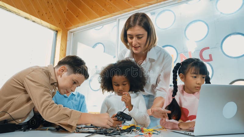 Smart Teacher Teaching Students about Car Model or Electrical Tool ...