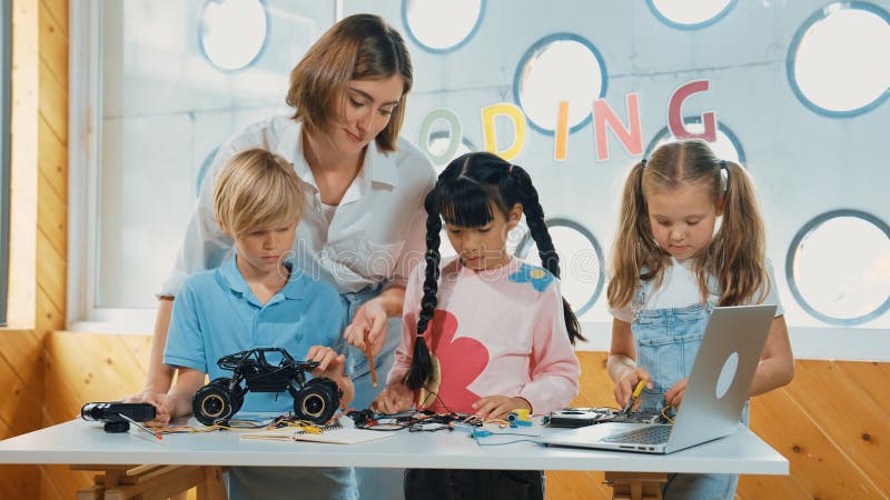 Smart Teacher Teaching Students about Car Model or Electrical Tool ...