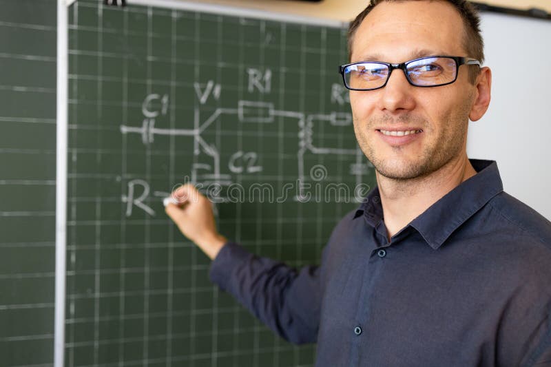 Portrait of a Confident Caucasian Male Teacher in Class Stock Photo ...