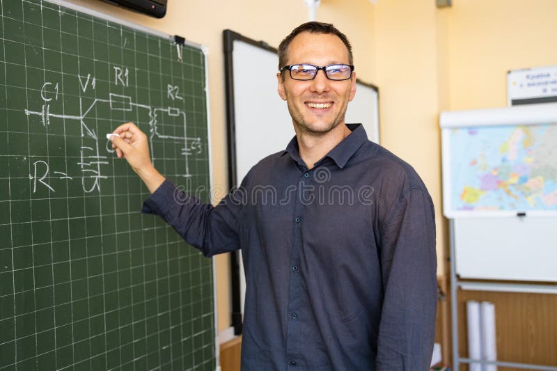 Portrait of a Confident Caucasian Male Teacher in Class Stock Photo ...
