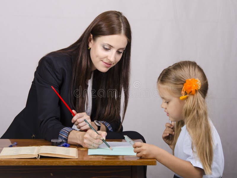 The Teacher Teaches Lessons with a Student Sitting at the Table Stock ...