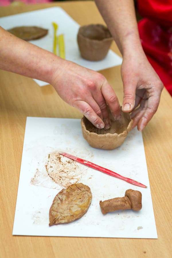 The Teacher Teaches the Student To Sculpt with Clay. Stock Photo ...