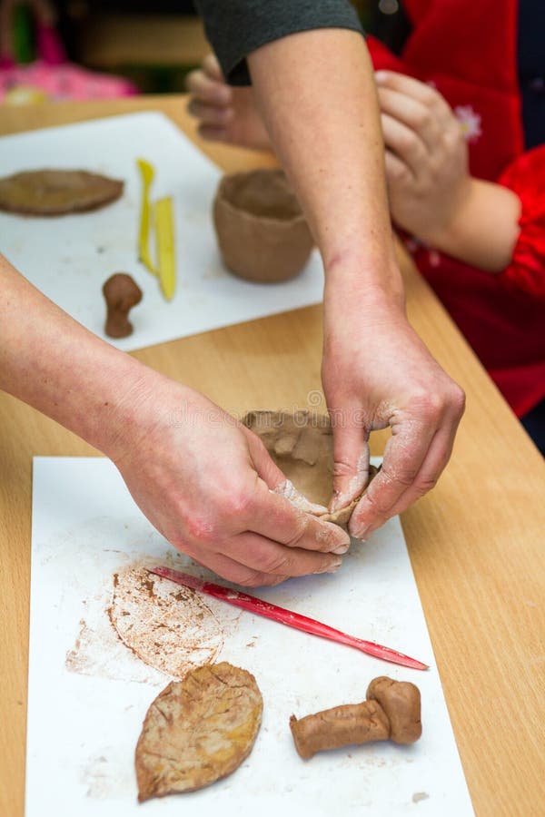 The Teacher Teaches the Student To Sculpt with Clay. Stock Image ...