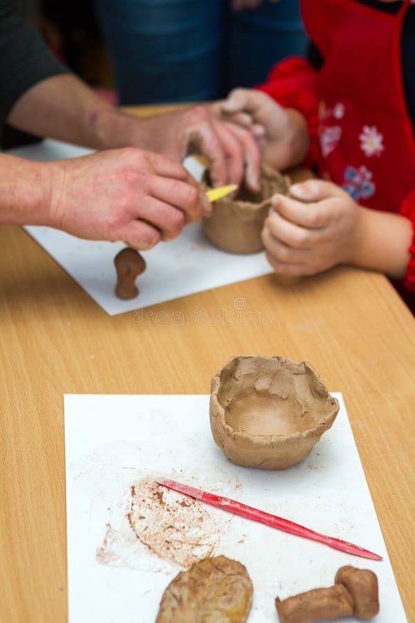 The Teacher Teaches the Student To Sculpt with Clay. Stock Photo ...