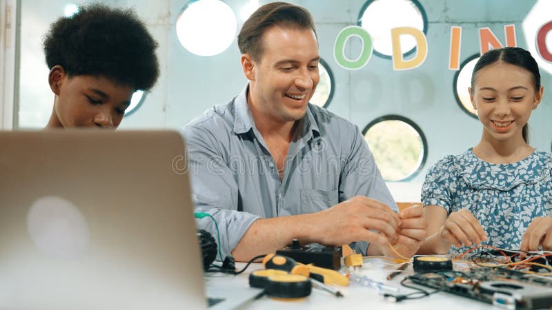 Teacher Teaching Diverse Students Fixing Car Model by Using Wire ...