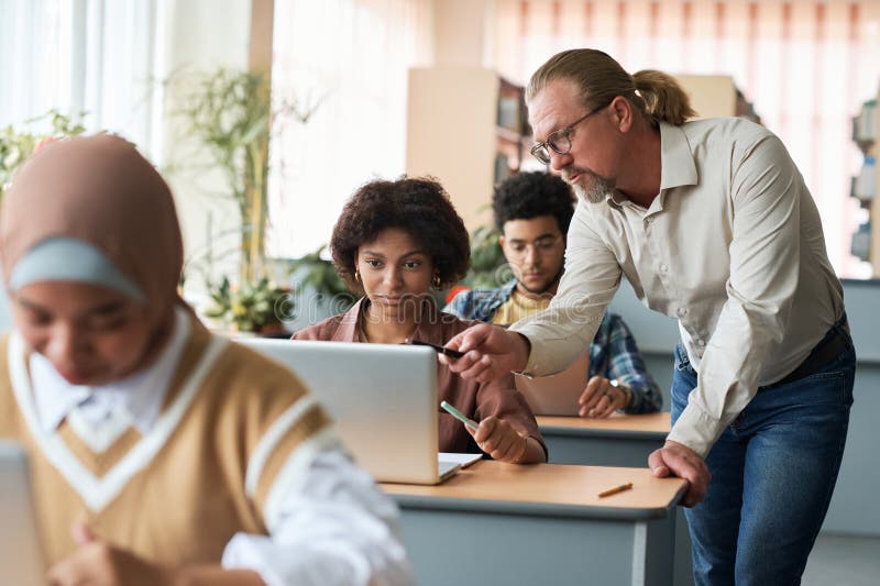 Teacher Teaching Foreign Students in Class Stock Photo - Image of ...