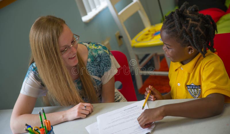 Teacher Teaching Her Student in a Classroom.Located in Orlando Florida ...