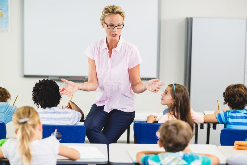 Teacher Teaching Kids in Classroom Stock Photo - Image of caucasian ...