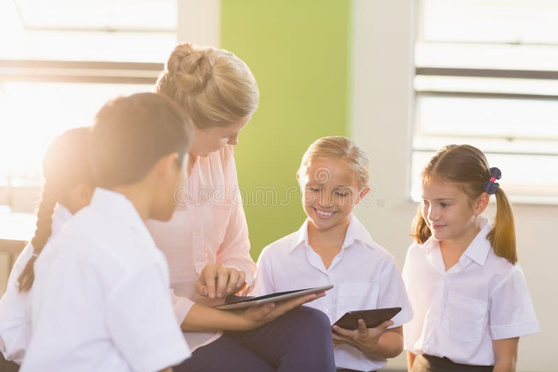 Teacher Teaching Kids on Digital Tablet Stock Image - Image of ...