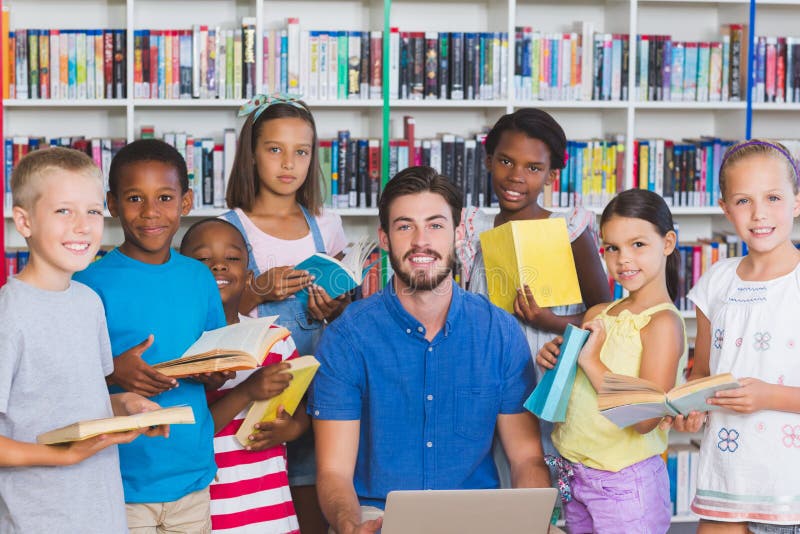 School Kids Sitting on Floor Using Digital Tablet in Library Stock ...