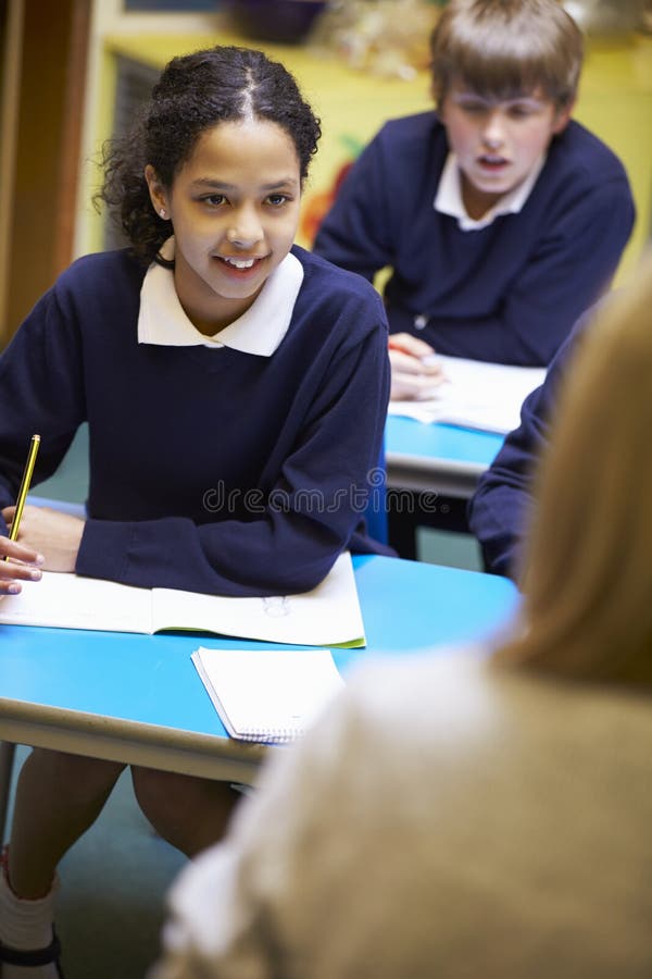 Teacher Talking To Elementary Pupils Classroom Stock Photos - Download ...
