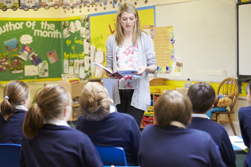 Teacher Teaching Lesson To Elementary School Pupils Stock Photo - Image ...