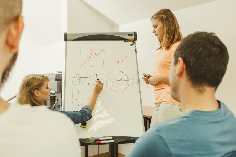 Teacher Teaching Mathematics To College Students Stock Photo - Image of ...