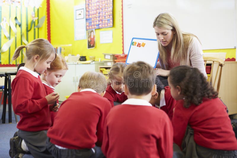 Teacher Teaching Spelling To Elementary School Pupils Stock Photo ...