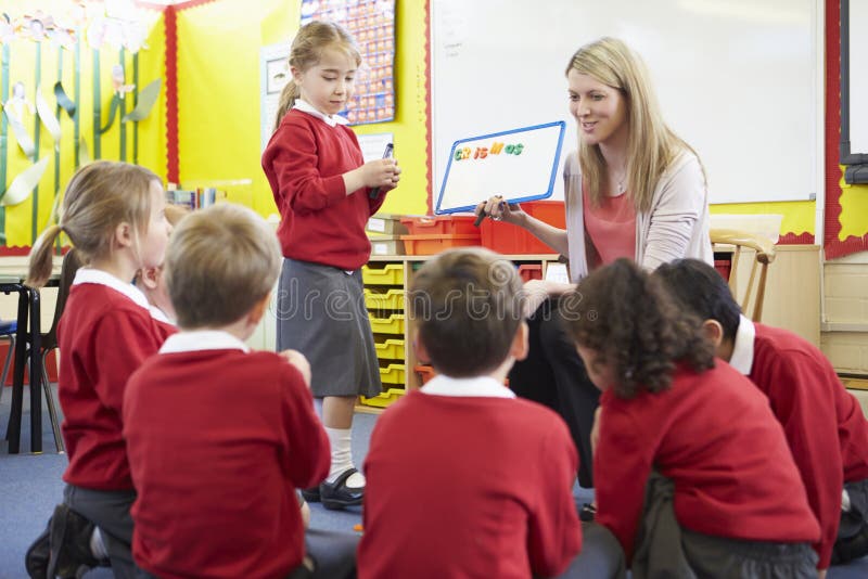 Teacher Teaching Spelling To Elementary School Pupils Stock Photo ...