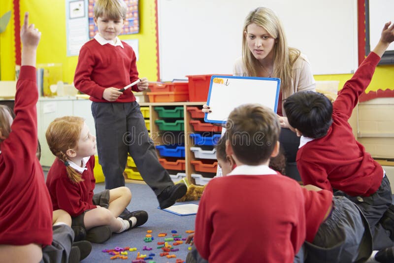 Teacher Teaching Spelling To Elementary School Pupils Stock Image ...