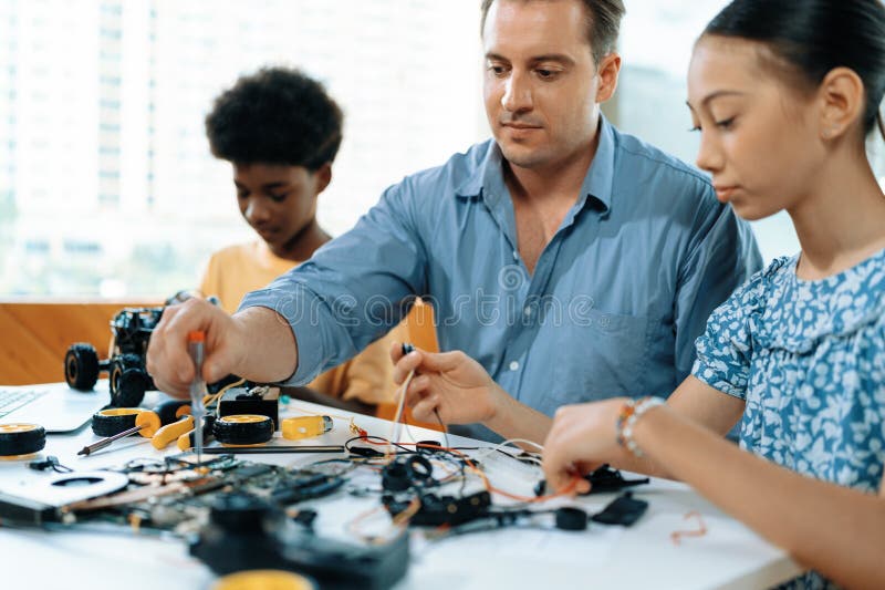 Teacher Teaching Students To Coding Robotics Car in STEM Class ...