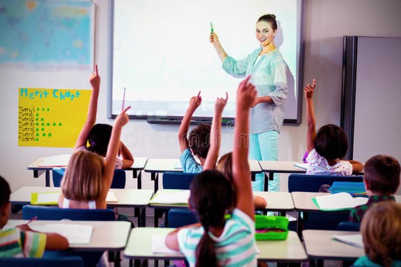 Teacher Teaching Students Using Projector in Classroom Stock Photo ...