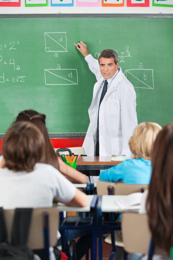 Young Teacher Writing on the Board Stock Photo - Image of people, real ...