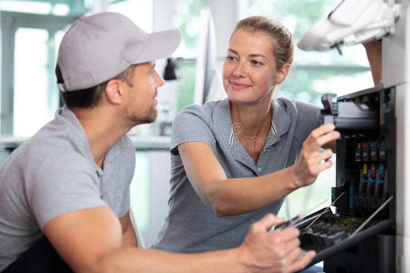 Teacher and Trainee Technician Repairing Printer Stock Photo - Image of ...