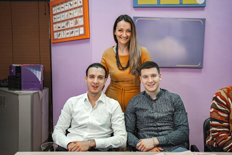 Teacher with Two Male Students at Language School Stock Image - Image ...