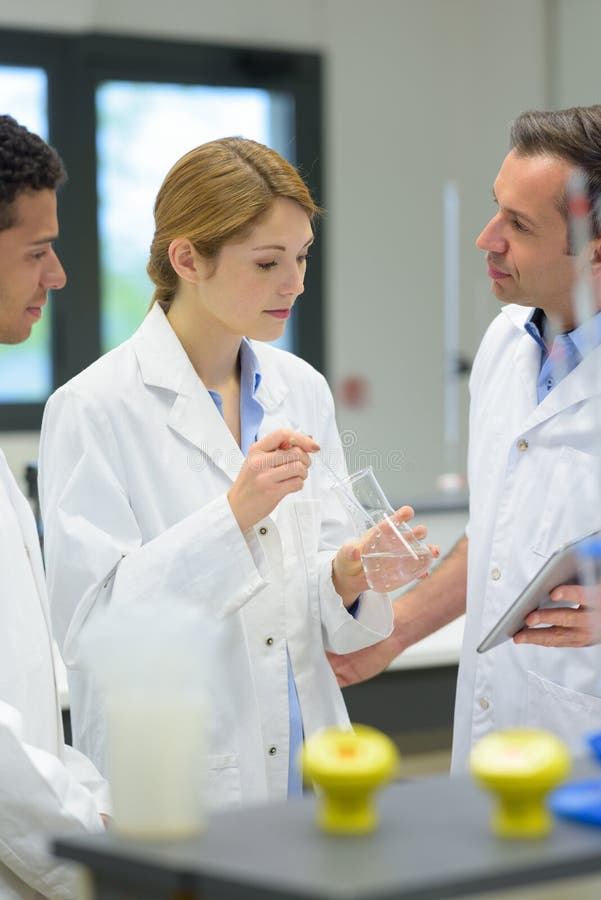 Teacher with University Students in Science Lab Stock Image - Image of ...