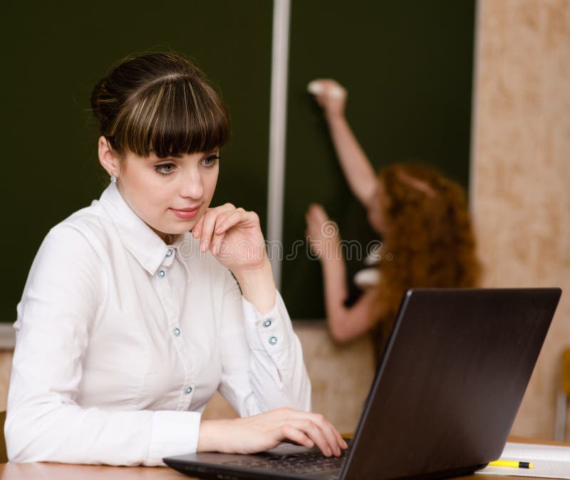 Teacher Using a Laptop Computer at School Stock Image - Image of ...