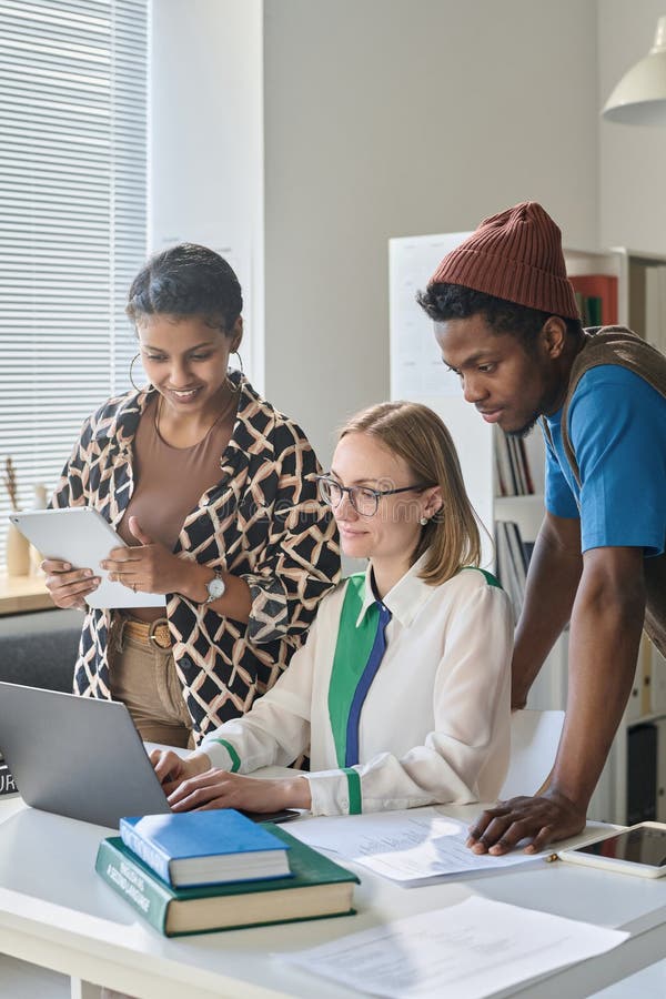 Teacher Using Laptop for Online Lesson Stock Photo - Image of table ...
