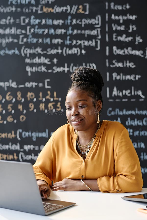 Teacher Using Laptop for Online Lesson Stock Photo - Image of table ...