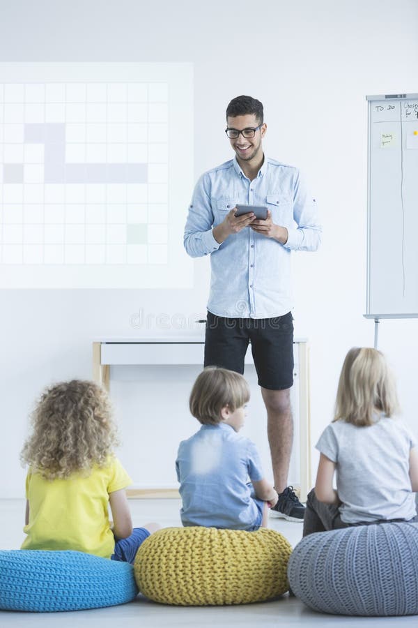 Teacher Using Tablet during Classes Stock Image - Image of pupils ...
