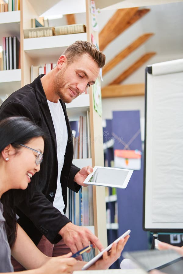 Teacher Using Tablet in Computer Science Class Stock Photo - Image of ...
