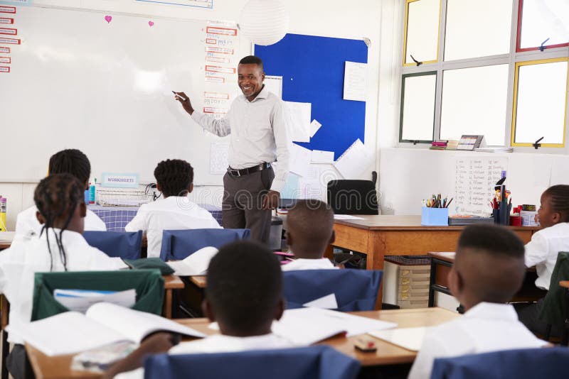Teacher Using Whiteboard during a Lesson at an Elementary School Stock ...