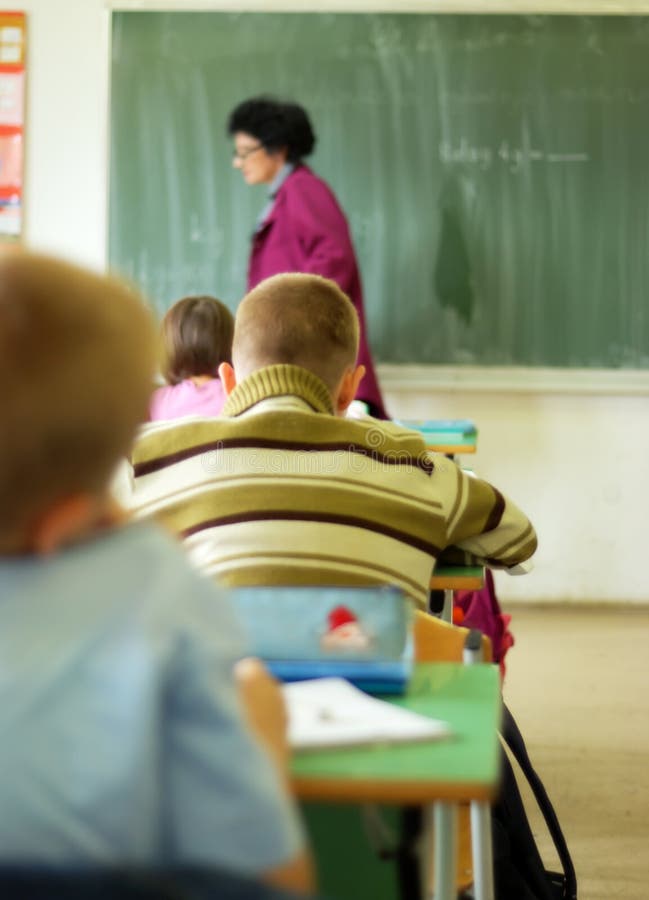 Teacher Walking in Classroom Stock Image - Image of pupil, look: 9910799