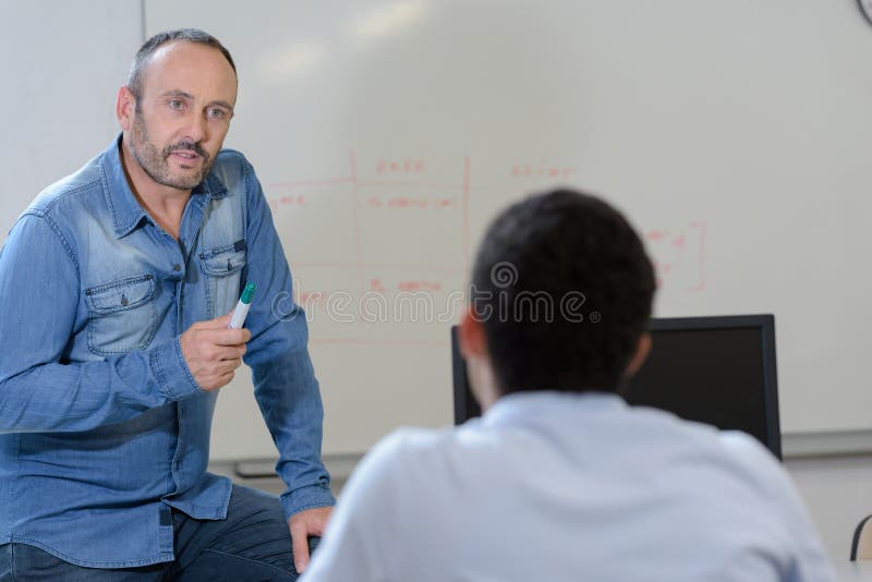 Teacher at Whiteboard Asking Student Question Stock Image - Image of ...