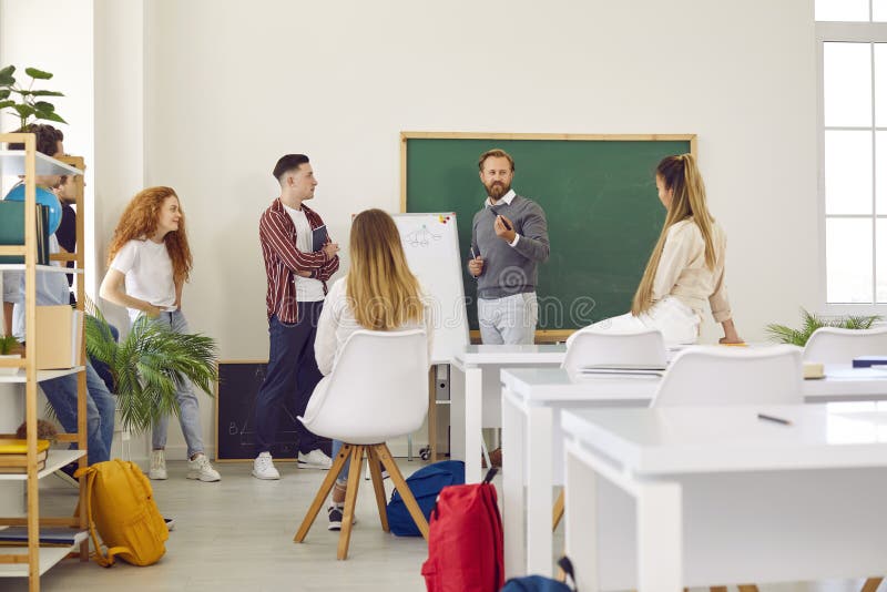 Teacher with Whiteboard Conducts Lesson for Students, Explaining ...