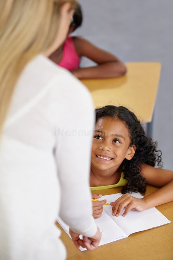 Teacher Woman, Classroom and Help Girl at Desk with Notebook, Advice ...
