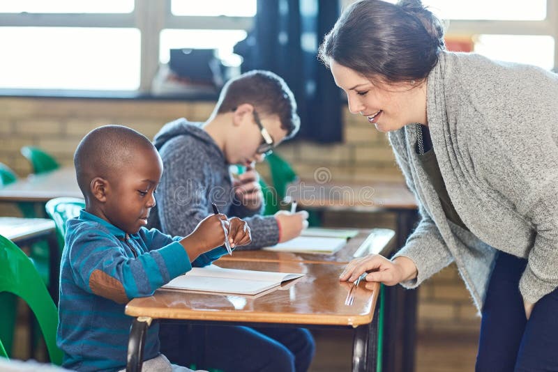 Teacher, Woman and Help Child Writing in Notebook for Education, Study ...