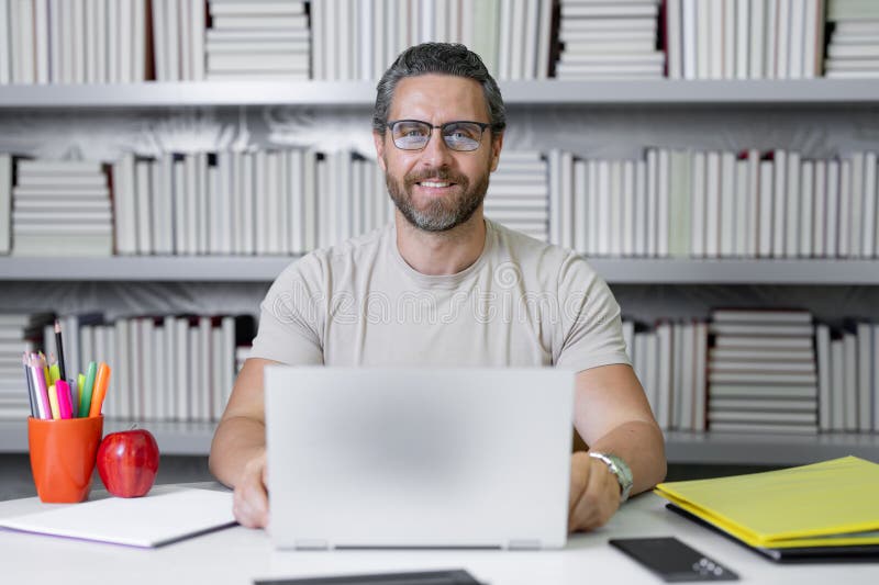 Teacher Work on Laptop in Classroom. Knowledge and Education with ...