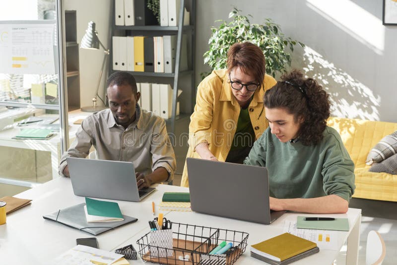 Teacher Working with Students at Office Stock Image - Image of women ...