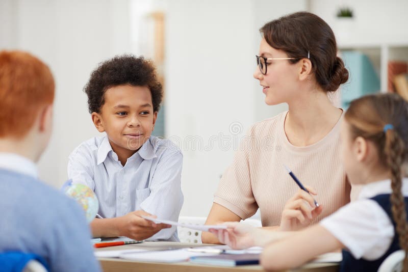 Teacher Working Together with Students Stock Photo - Image of meeting ...