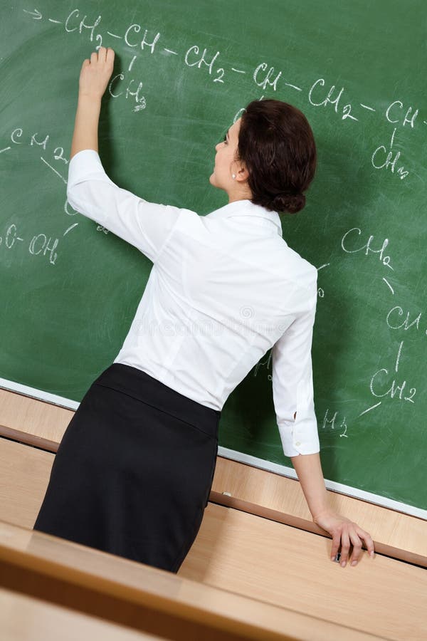 Teacher Writes with Chalk at the Blackboard Stock Image - Image of ...