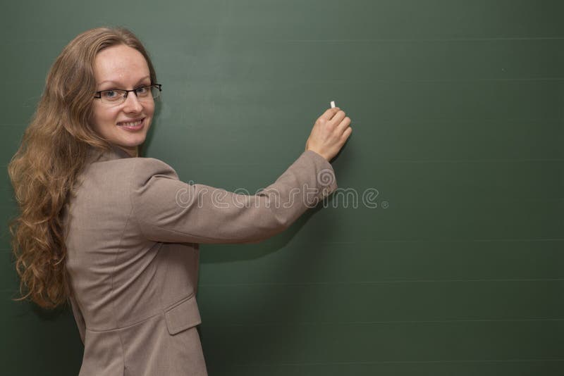 Teacher is Pointing To Something on the Board Stock Image - Image of ...