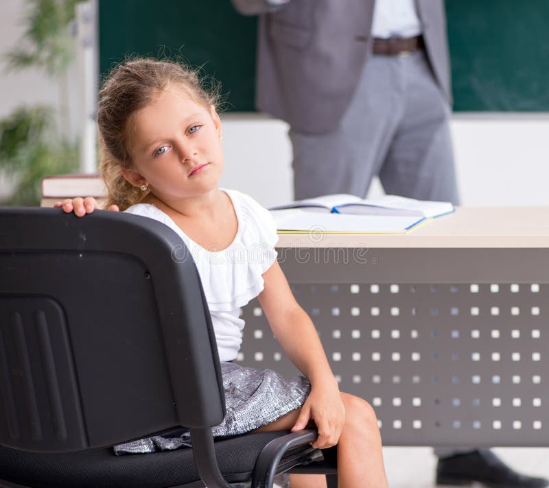 Teacher with Young Girl in the Classroom Stock Image - Image of child ...