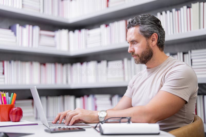 Teachers Day. Teacher Tutor Using Laptop in School Classroom. Knowledge ...