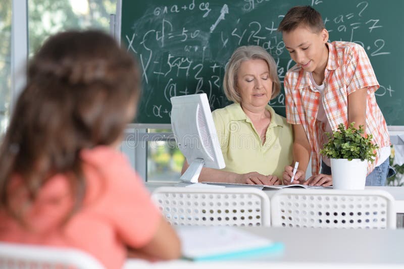 Teachers Working with Pupils Stock Photo - Image of modern, girl: 105412800