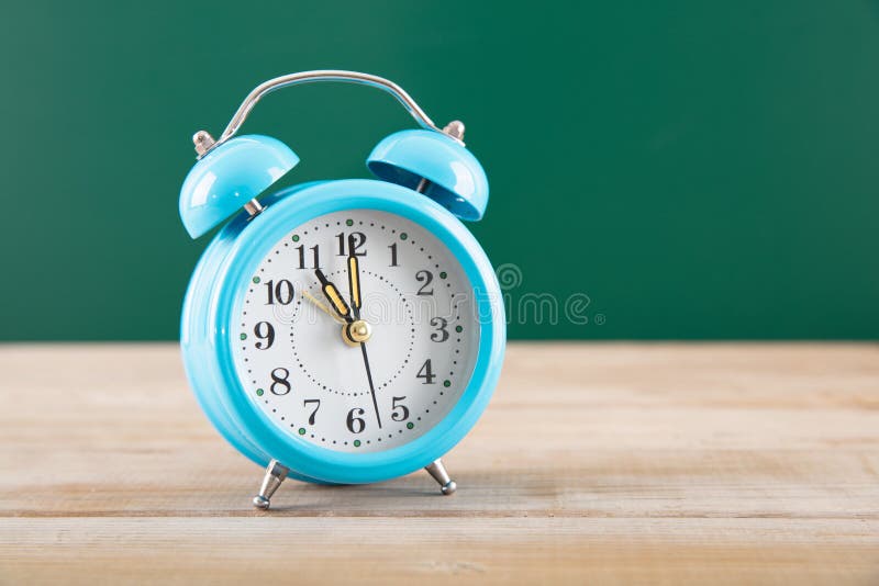 Teaching a Blue Alarm Clock in Front of Blackboard Stock Photo - Image ...
