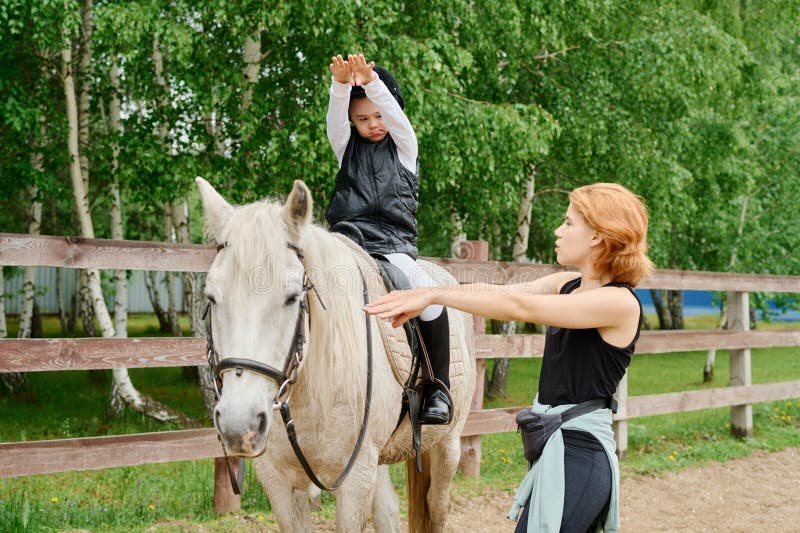 Teaching Child Horse Riding in Green Forest Setting Stock Image - Image ...