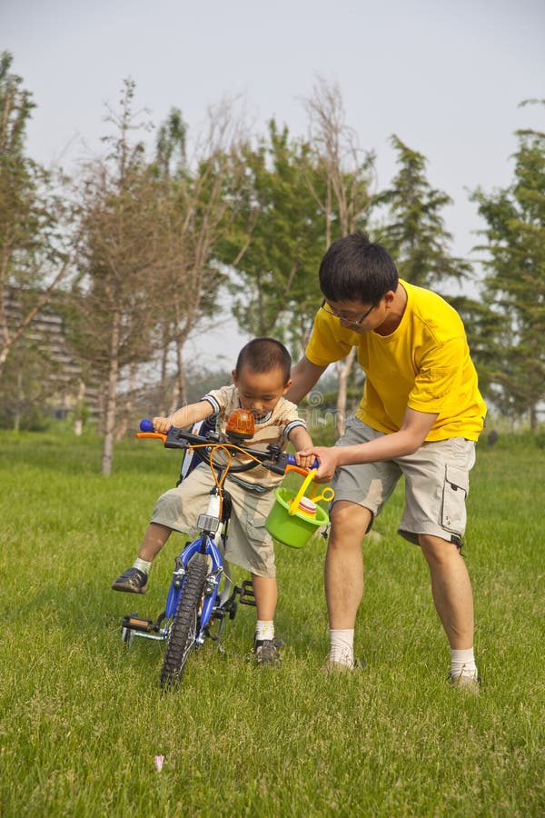 Teaching cycling stock photo. Image of childhood, innocent - 14623594